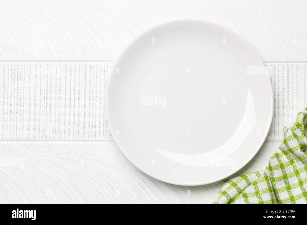 Empty plate on wooden table. Top view flat lay with copy space ...