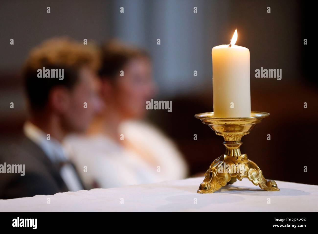 Wedding ceremony in a catholic church. Church candel Stock Photo - Alamy