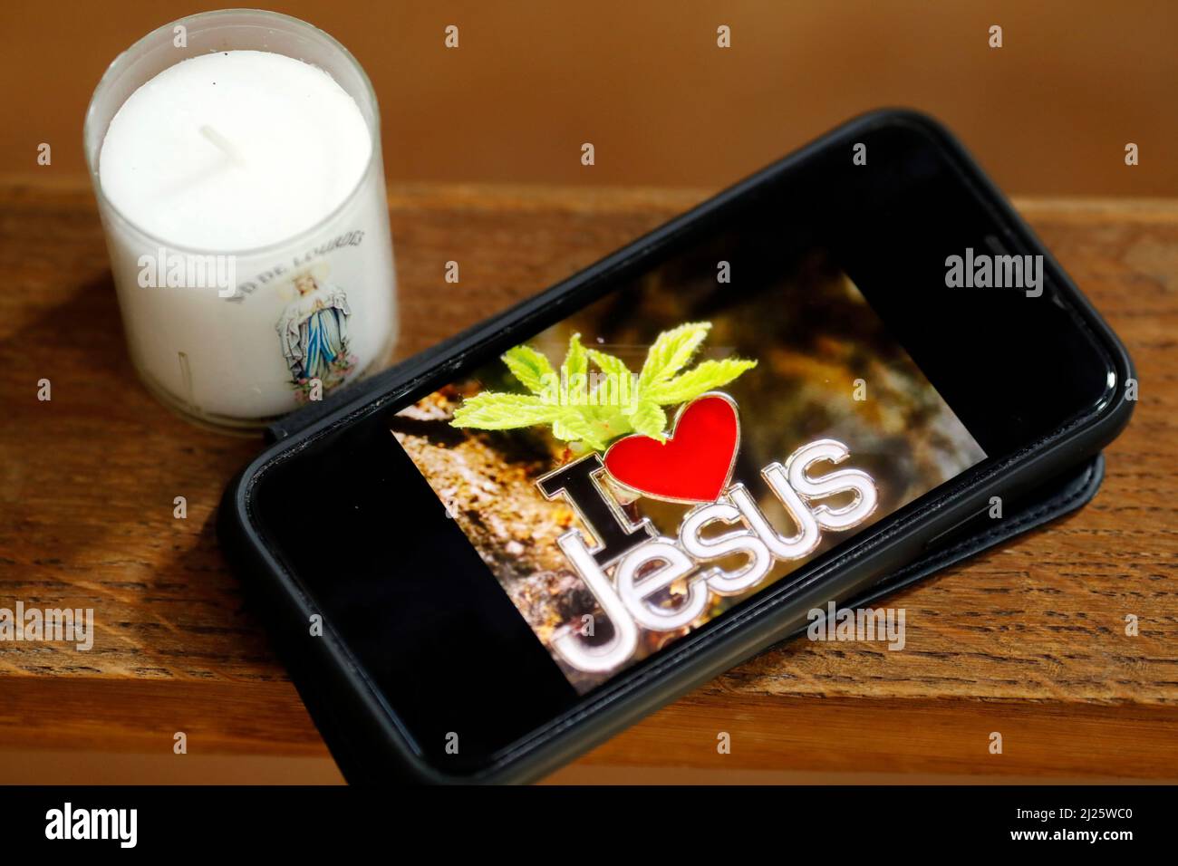 I love Jesus on smartphone and church candel. Faith and religion ...