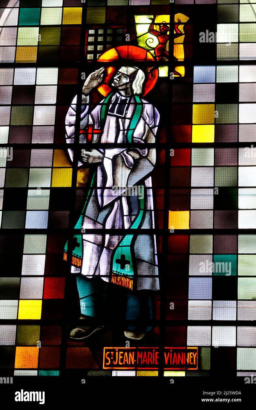 Saint Leger church. Stained glass window. Saint John Vianney, was a ...