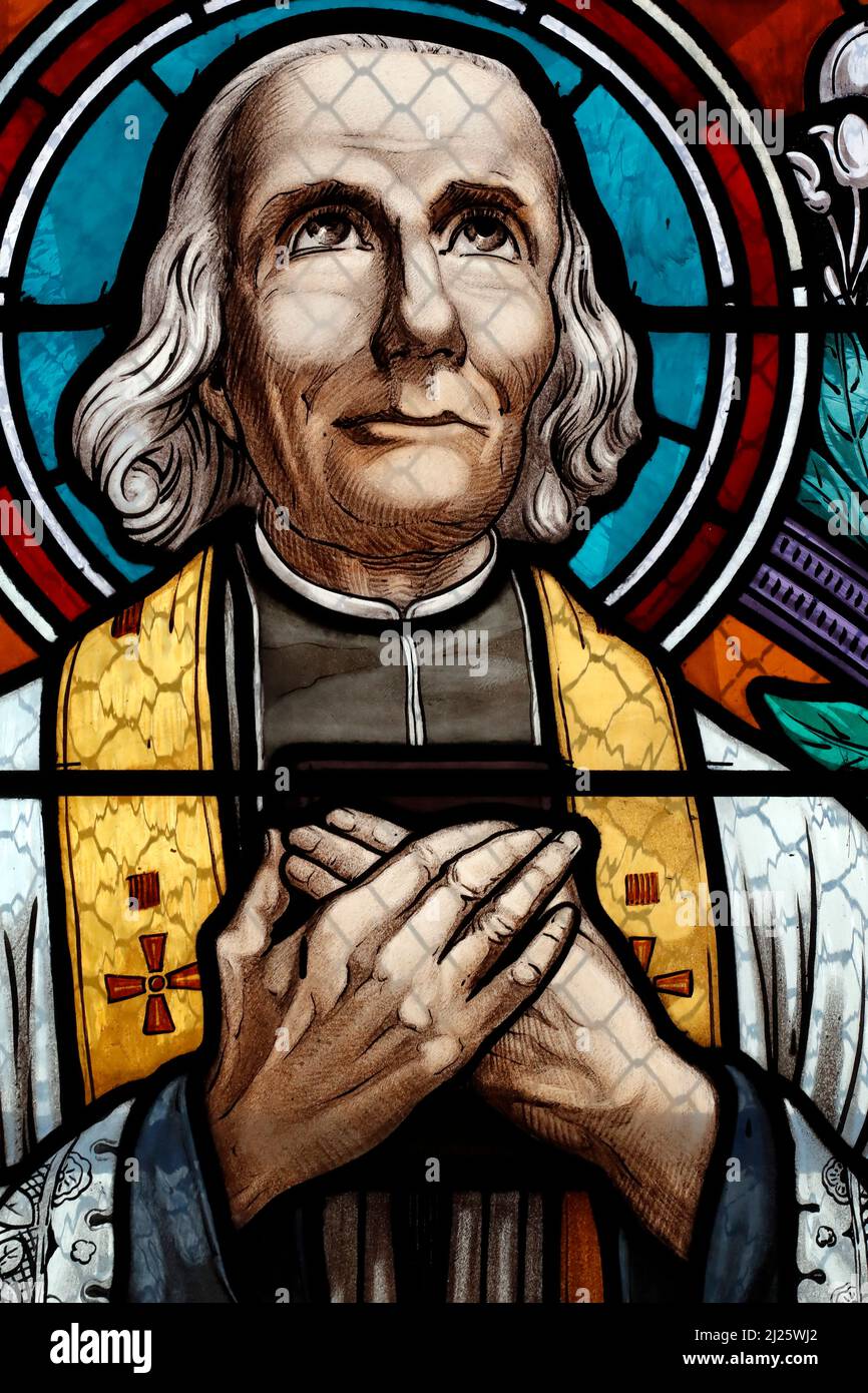 Saint Pothin church. Stained glass window. Saint John Vianney, was a ...