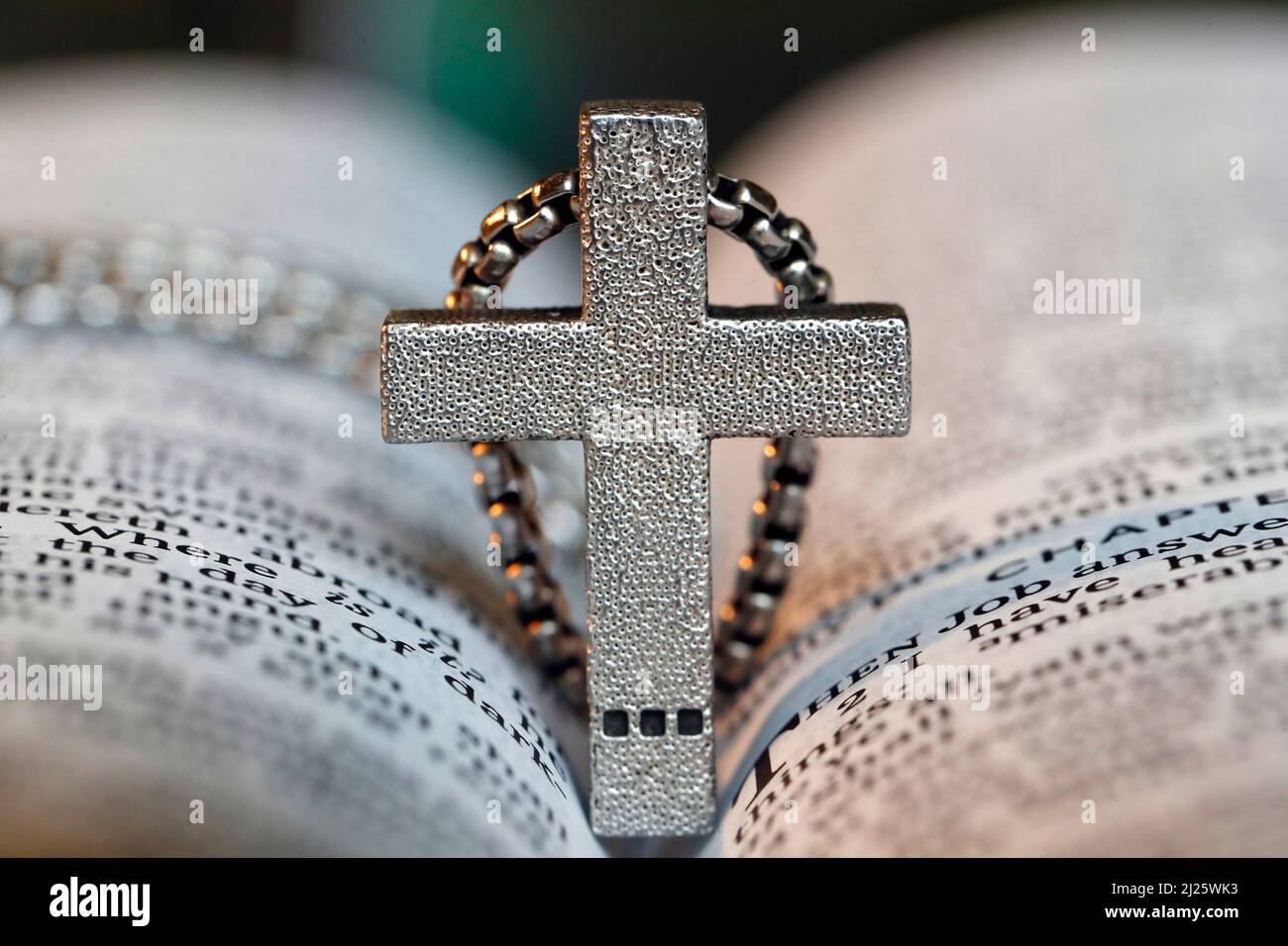 Open holy Bible book with a christian cross. Symbol of christian ...