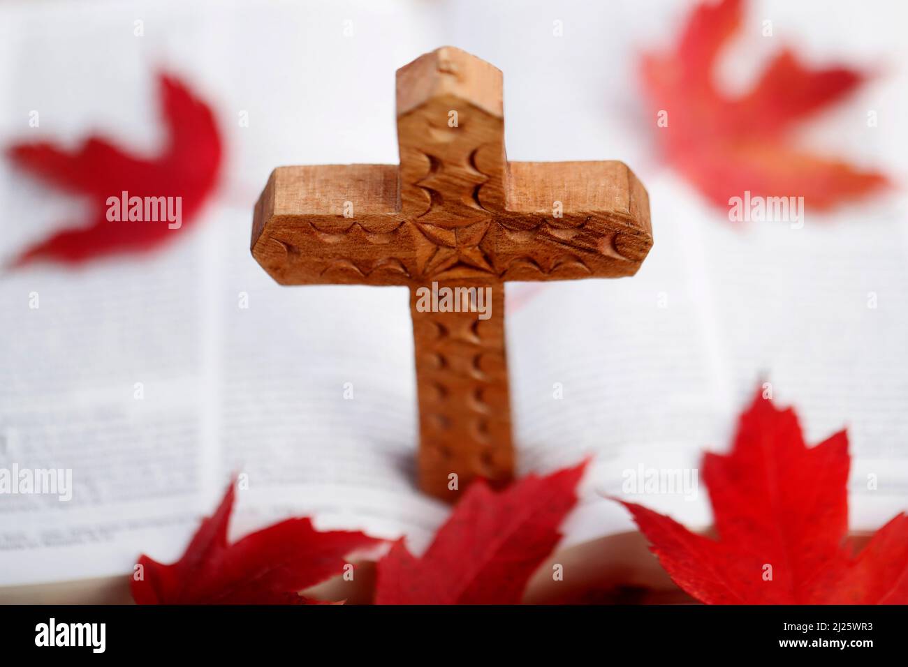 Open holy bible, christian wooden cross and autumn leaves Stock Photo ...