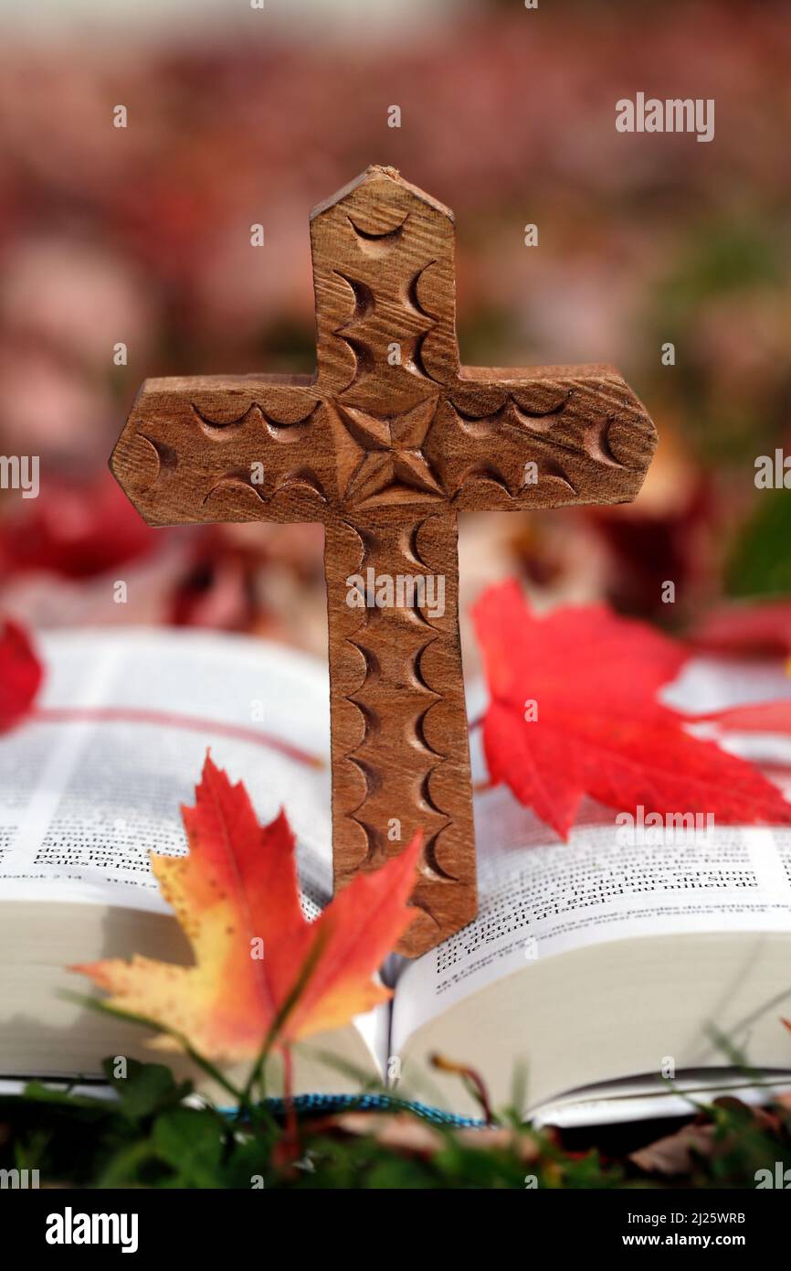 Open holy bible, christian wooden cross and autumn leaves Stock Photo ...
