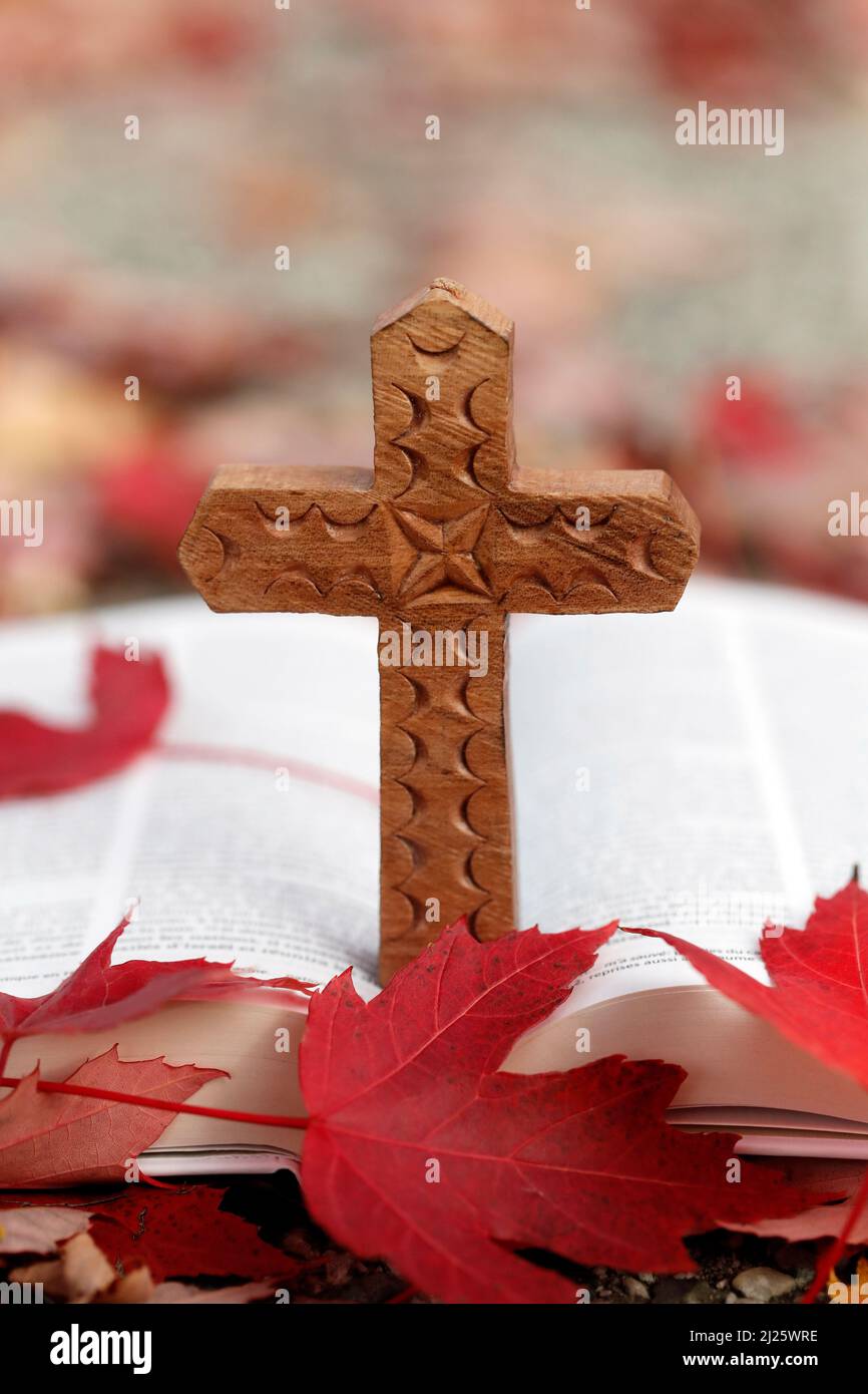 Open holy bible, christian wooden cross and autumn leaves Stock Photo ...