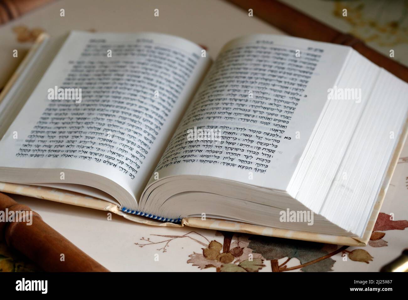 Open torah on a table. Jewish book Stock Photo - Alamy