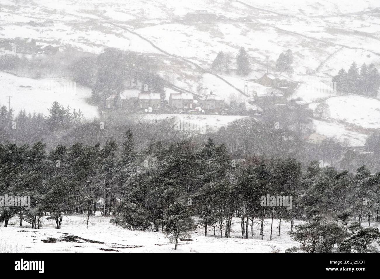 A blizzard in Nenthead, one of England's highest villages, in Cumbria ...