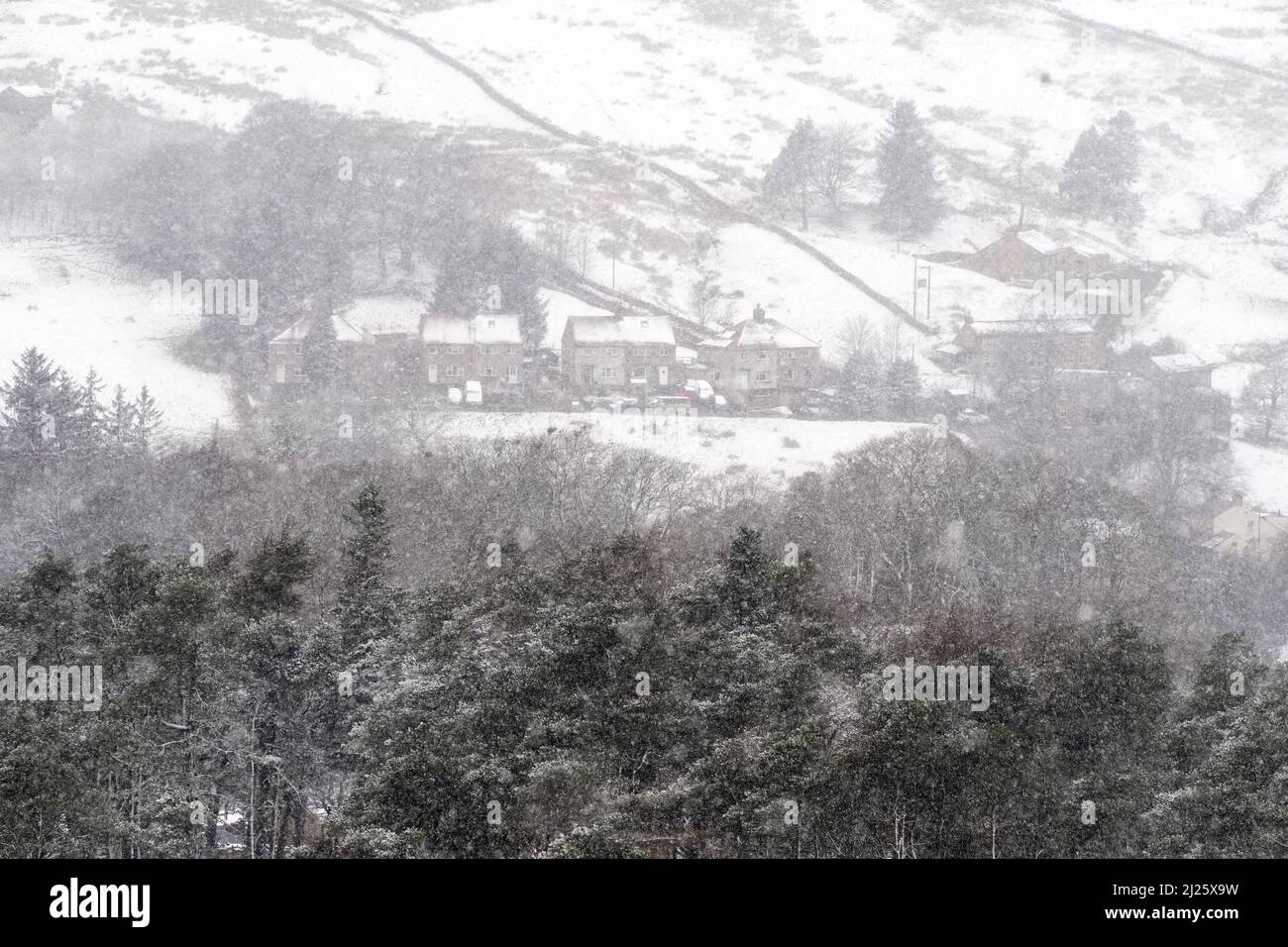 A blizzard in Nenthead, one of England's highest villages, in Cumbria ...