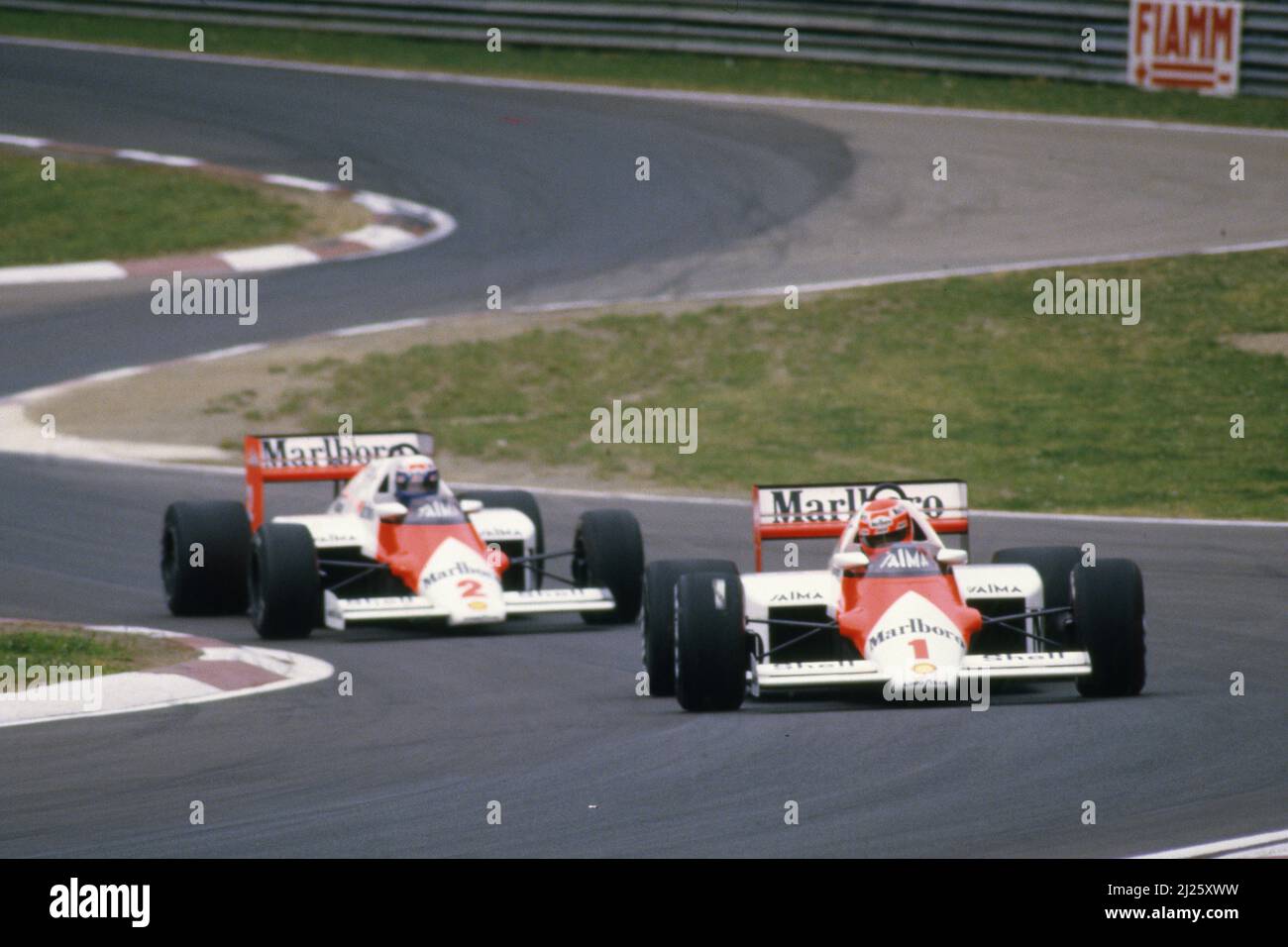 Niki Lauda (AUT) McLaren MP4/2B Tag Porsche leads team-mate Alain Prost ...