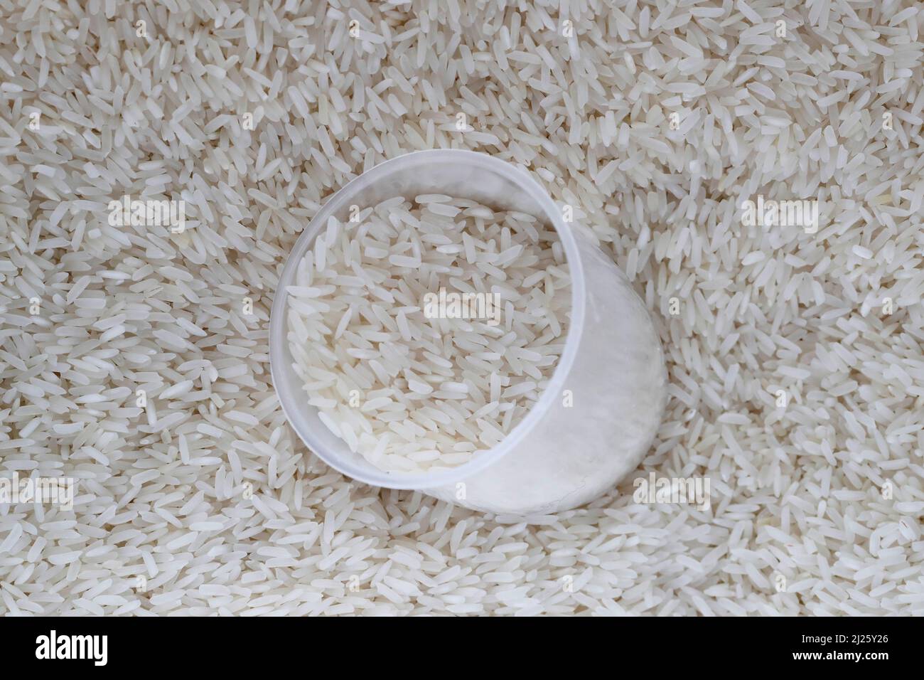 Rice for sale with a plastic cup Stock Photo - Alamy