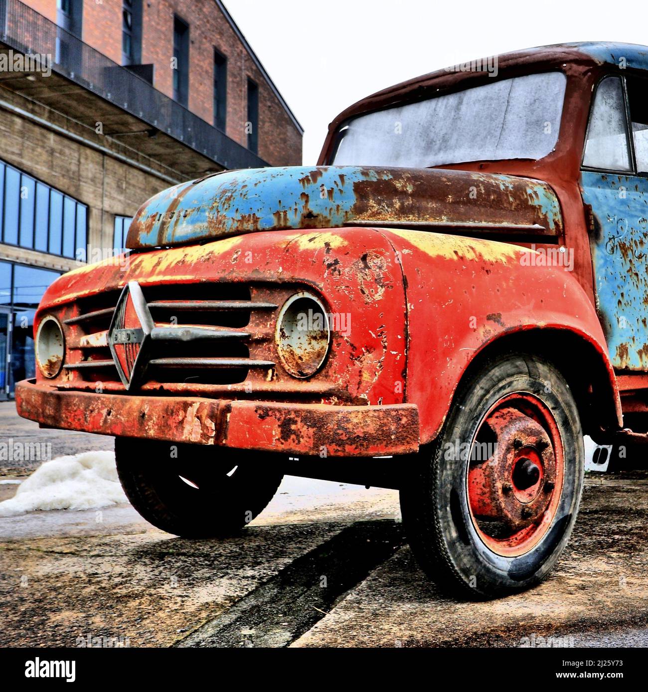 it is an old rusty borgward B 1500 transporter in the partial view they ...