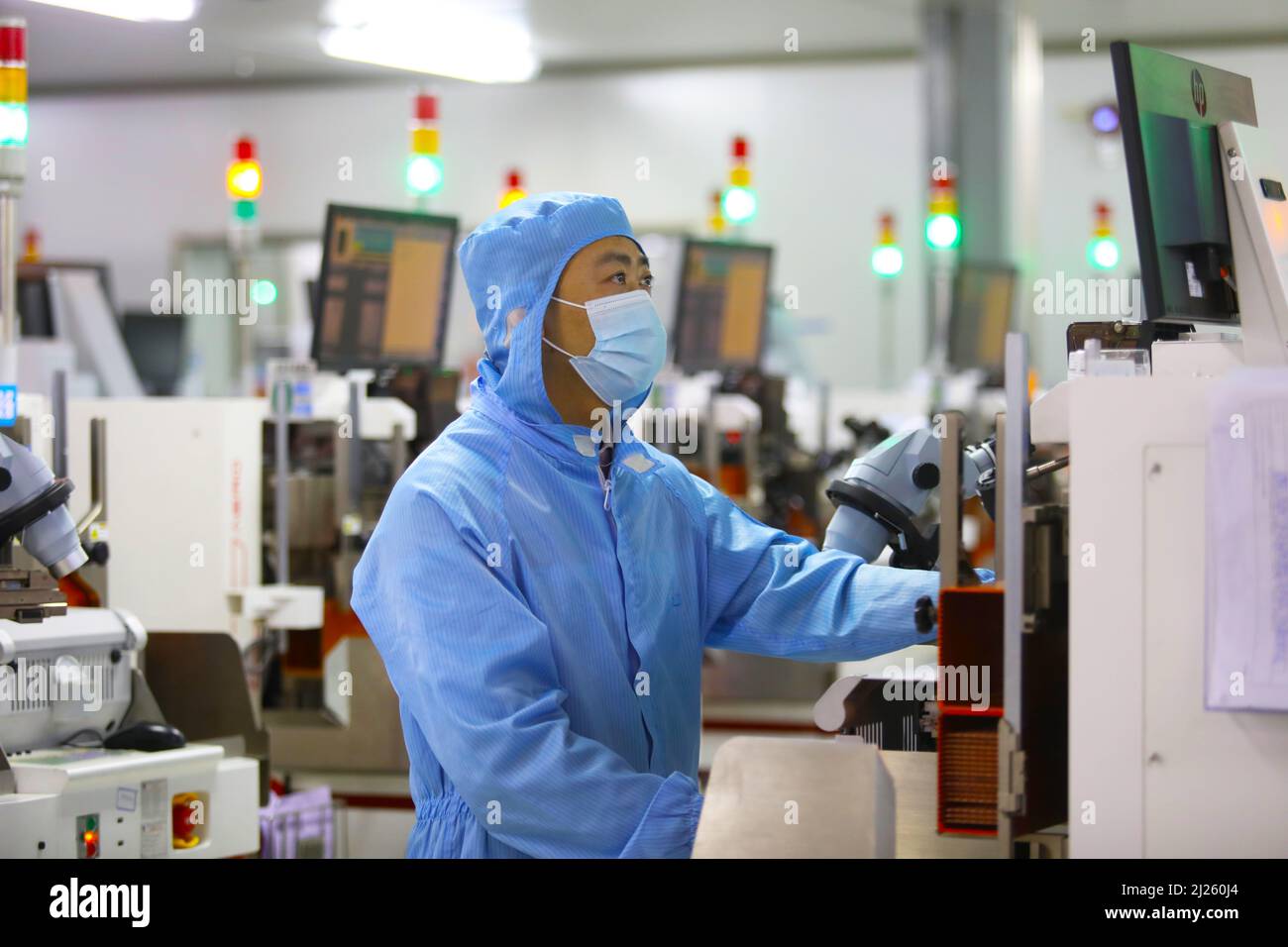 CHONGQING, CHINA - MARCH 30, 2022 - A worker watches the production of ...