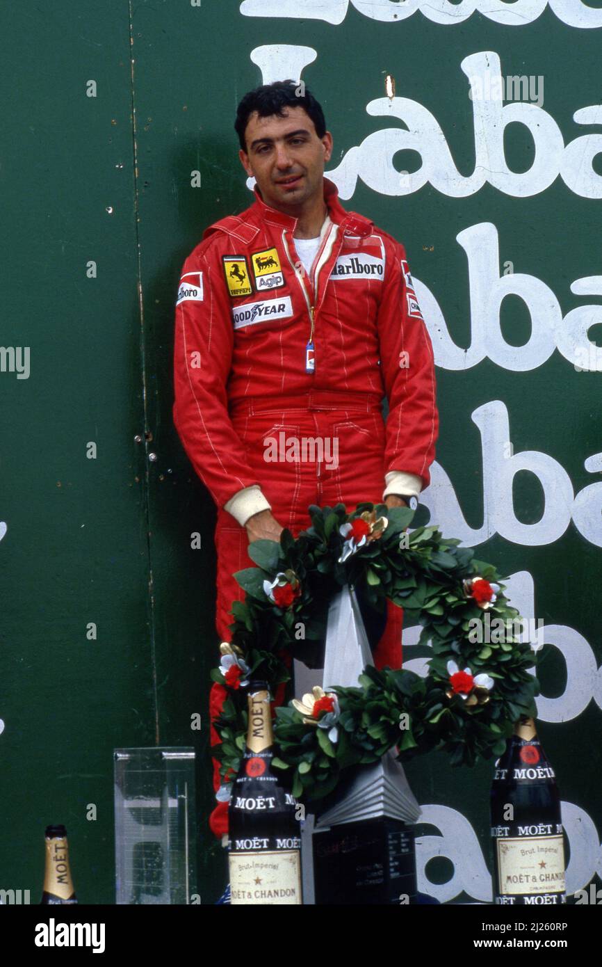 Michele Alboreto (ITA) Ferrari 156/85 1st position celebrates podium ...