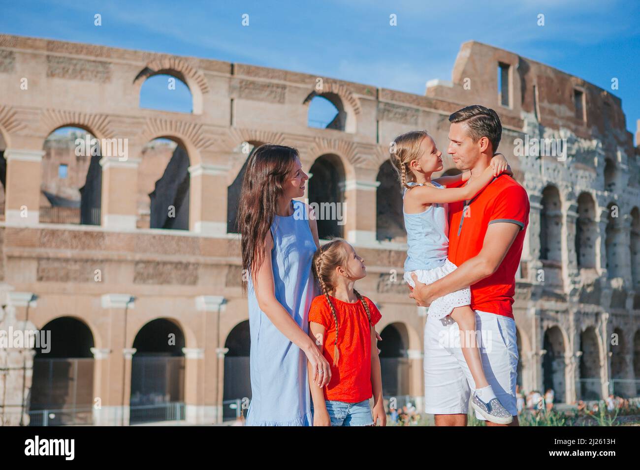 Happy family in Rome over Coliseum background having fun together Stock ...
