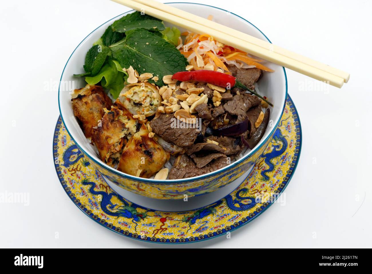Asian kitchen. Vietnamese cuisine. Bowl of beef Bo bun with salad, beef ...