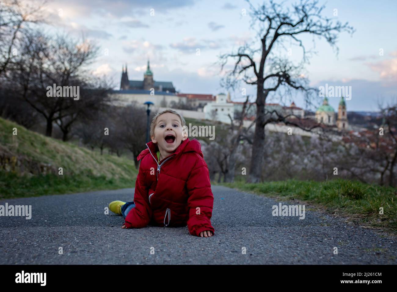 Happy child, toddler boy, visiting spring park in Prague, walking at ...