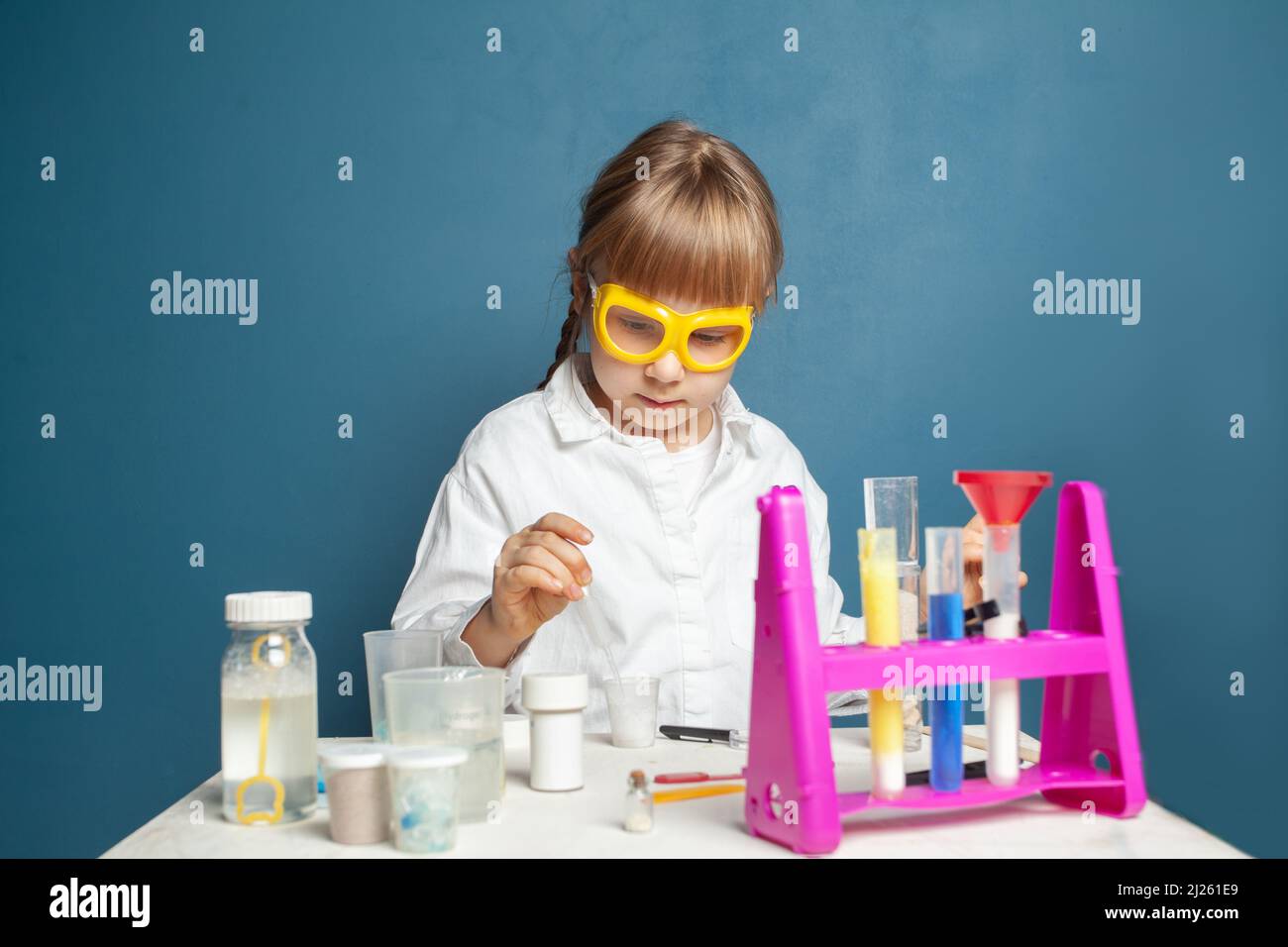 Portrait of kid girl student scientists making experiment in lab Stock ...