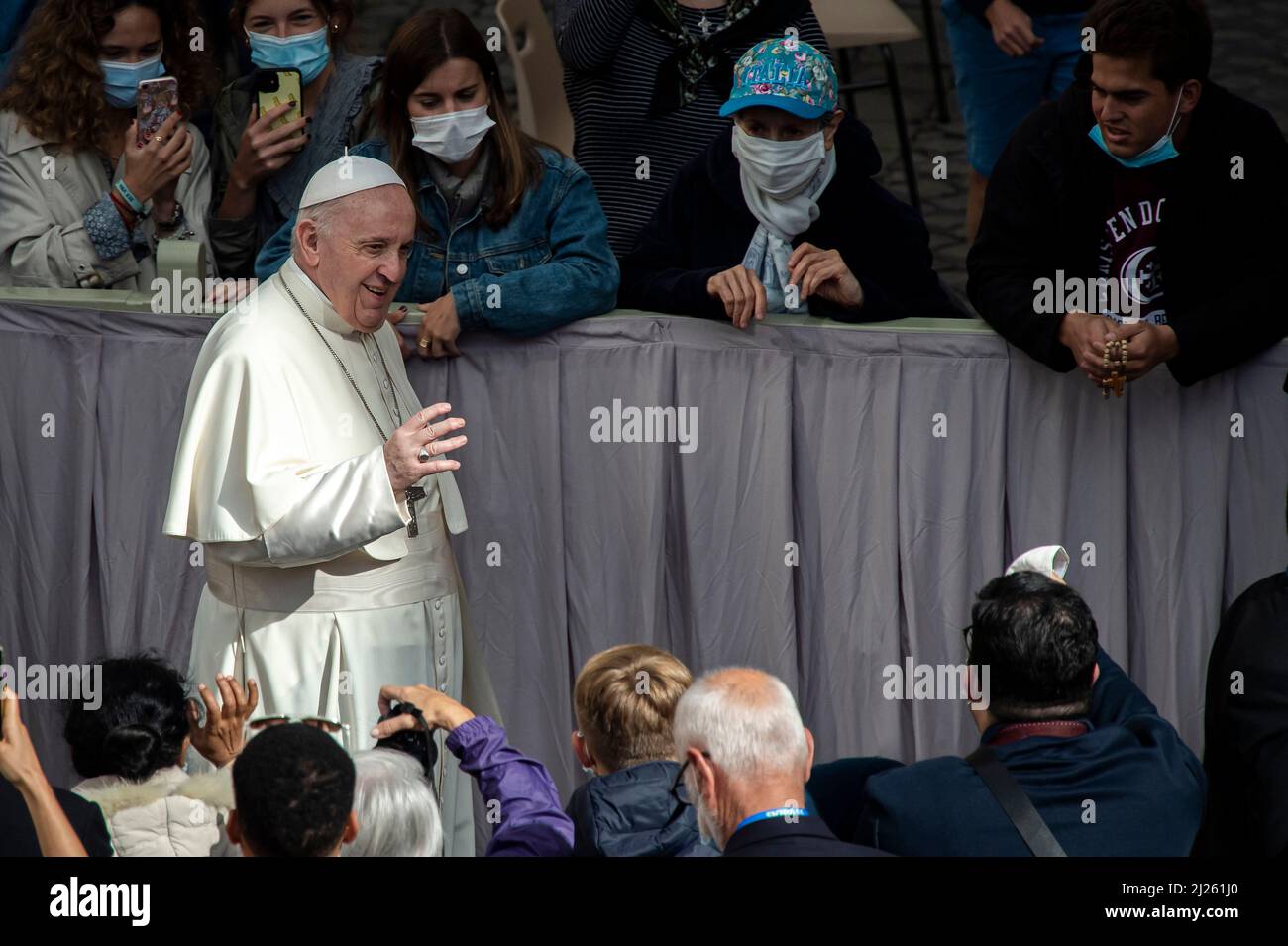 Pope Francis blesses attendees as he arrives at San Damaso courtyard in ...