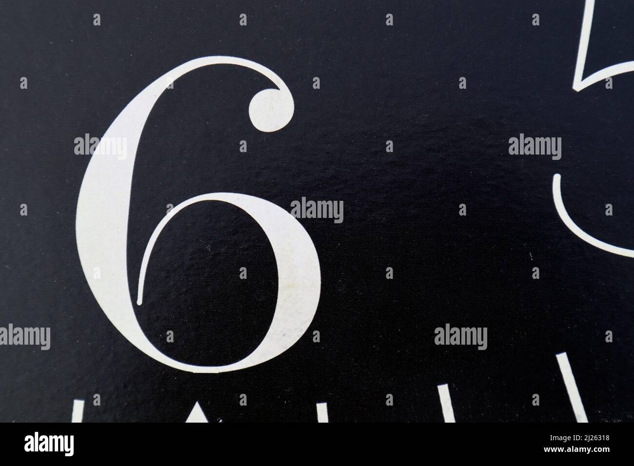 partial clock face with numbers five and six Stock Photo - Alamy