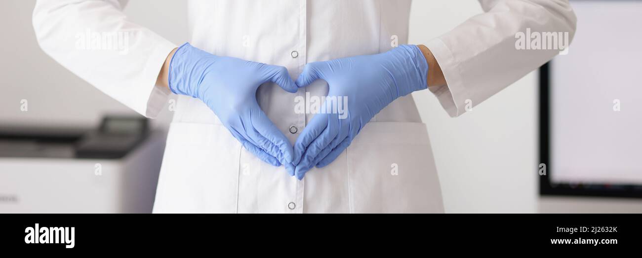 Woman showing heart sign with hands Stock Photo - Alamy