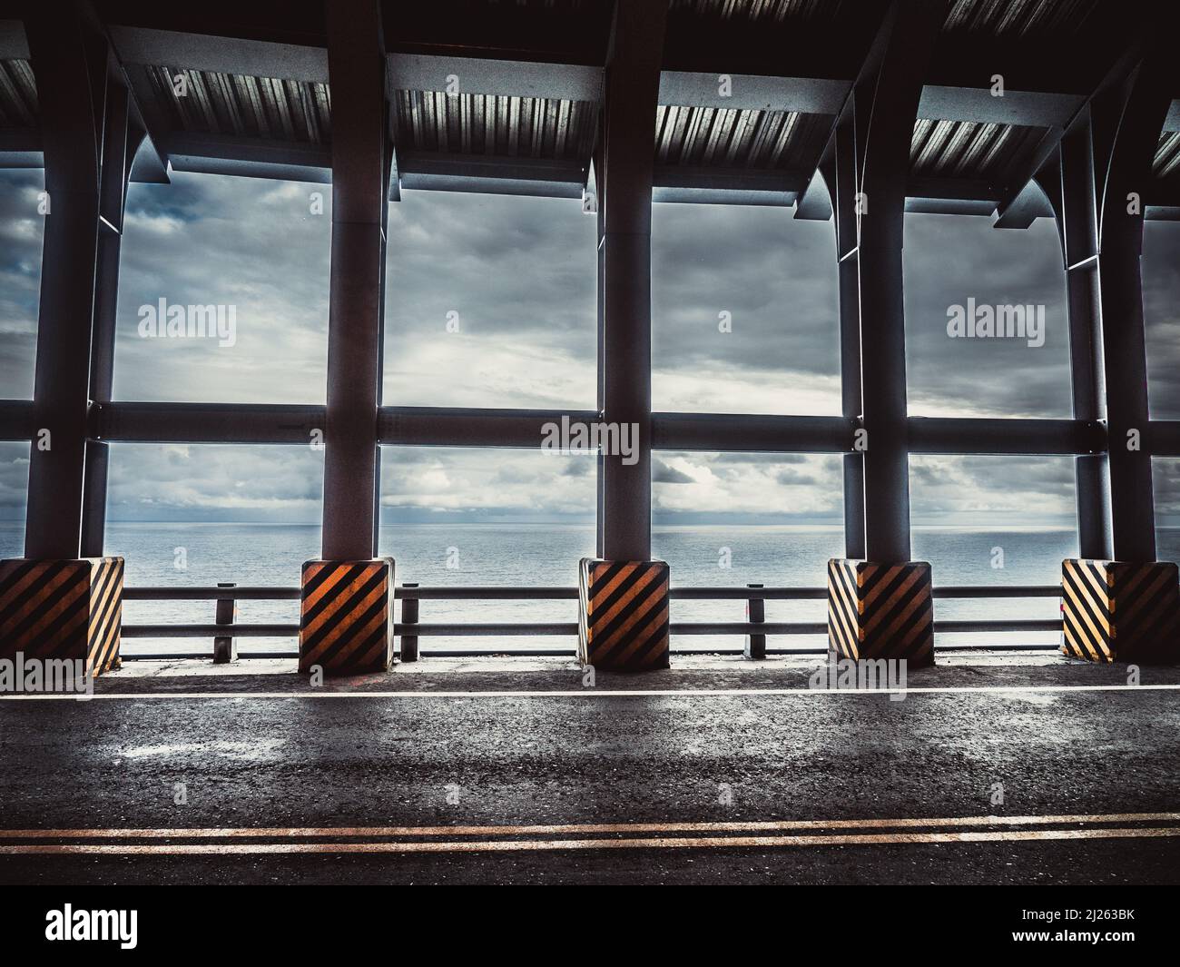 Pillars on highway with view of ocean, East coast of Taiwan Stock Photo ...
