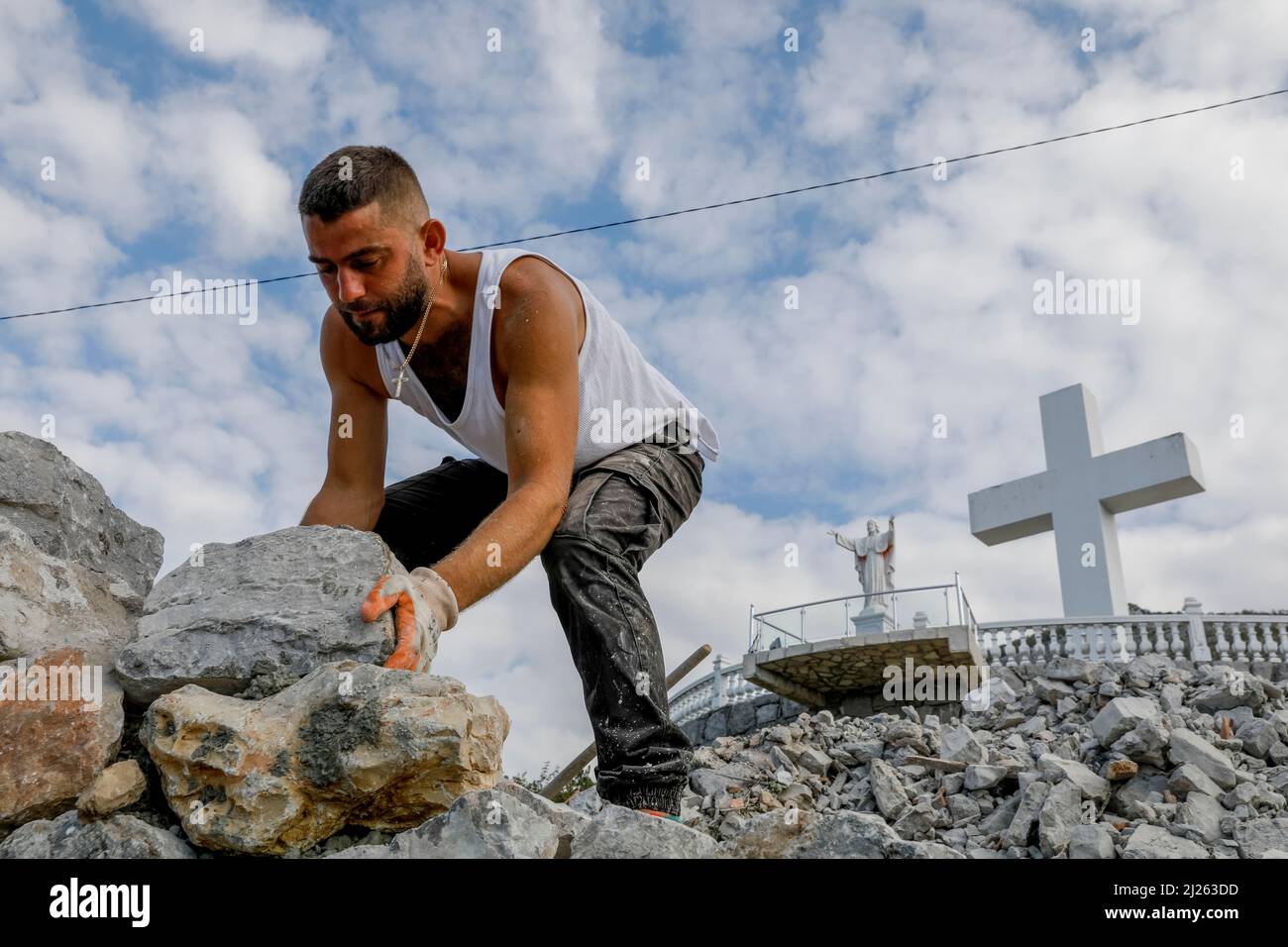 Christian Albanian builder at work in Delaj, montenegro Stock Photo - Alamy