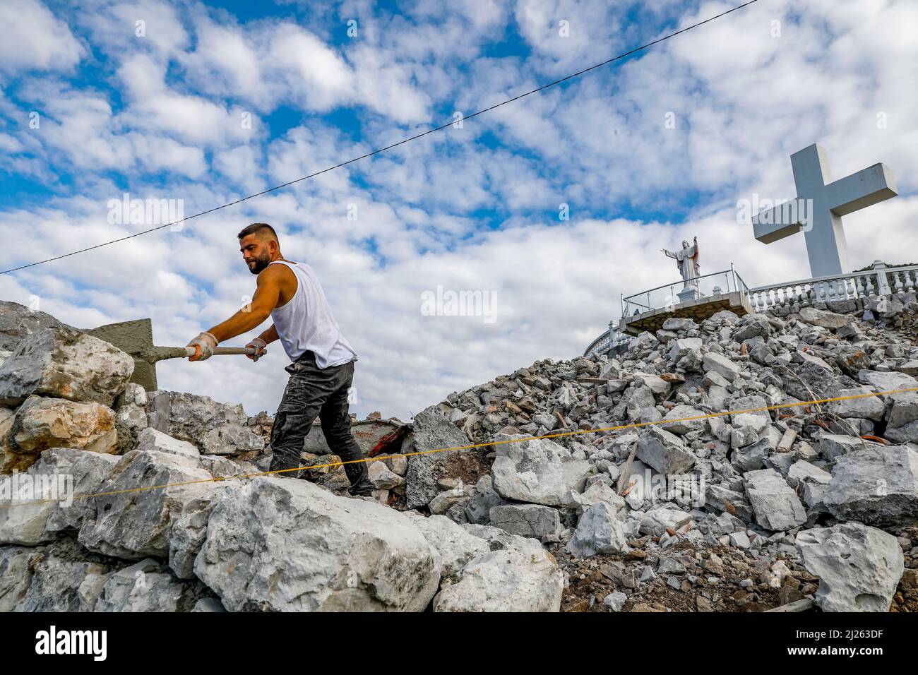 Christian Albanian builder at work in Delaj, montenegro Stock Photo - Alamy