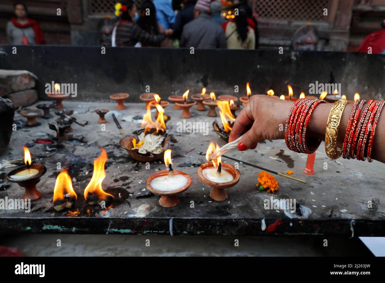 Oil butter lamps burning in hindu temple hi-res stock photography and ...