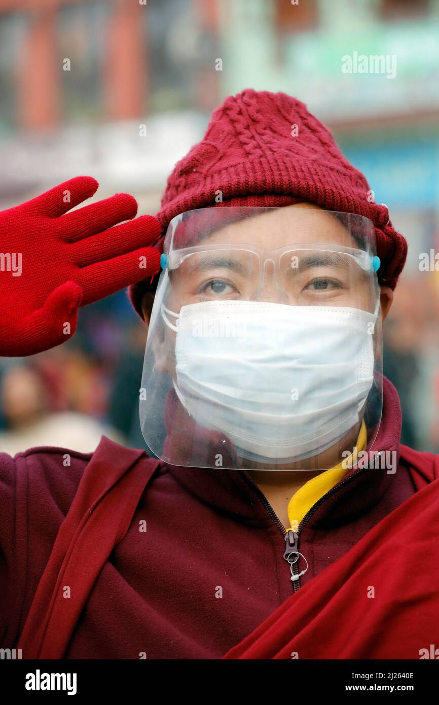 Tibetan monk wearing a surgical mask. Covid-19 pandemic Stock Photo - Alamy