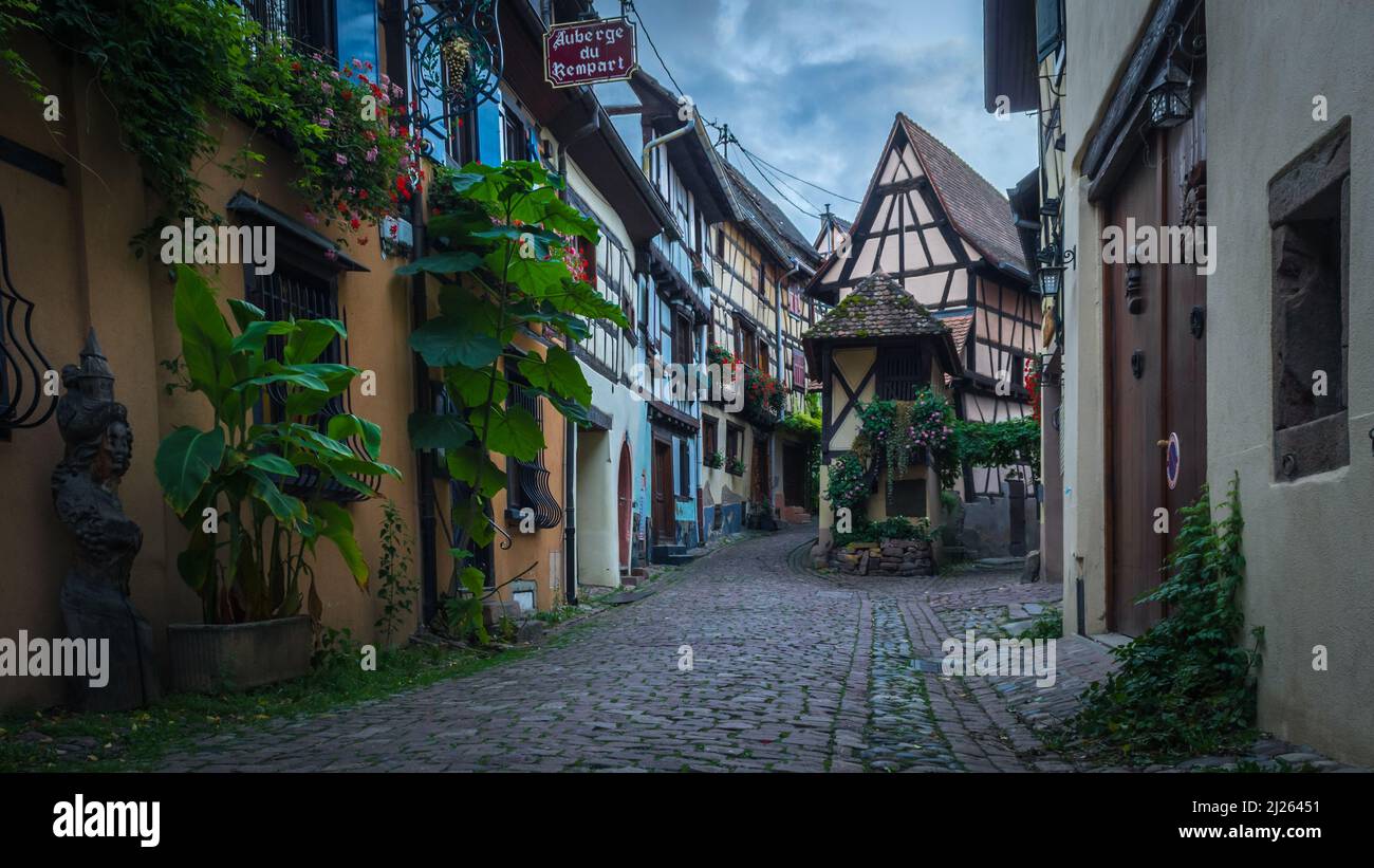 Medieval alley in Eguisheim with half timbered houses Stock Photo - Alamy