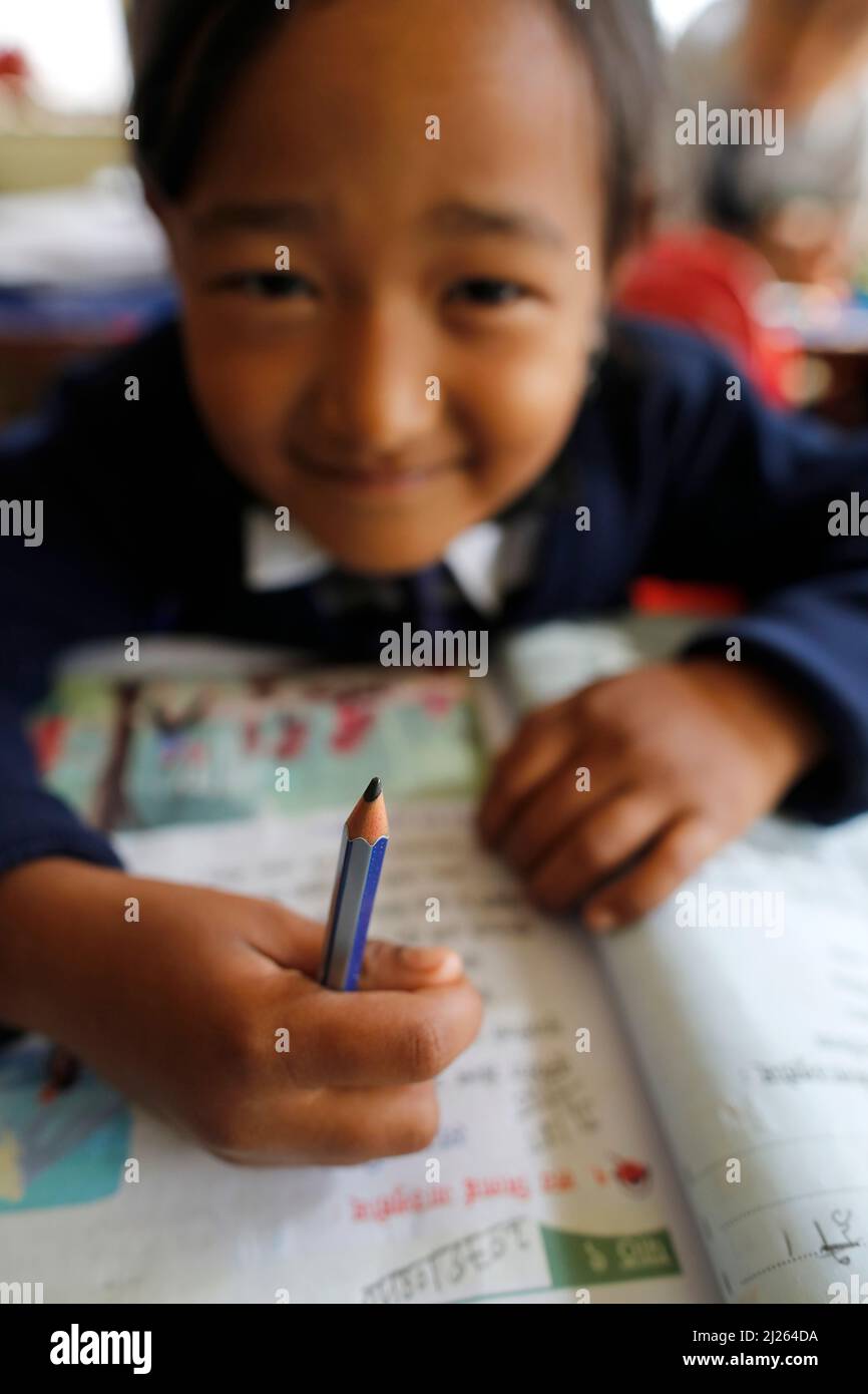 Primary school in Nepal. Boy with pencil. Concept of education and ...