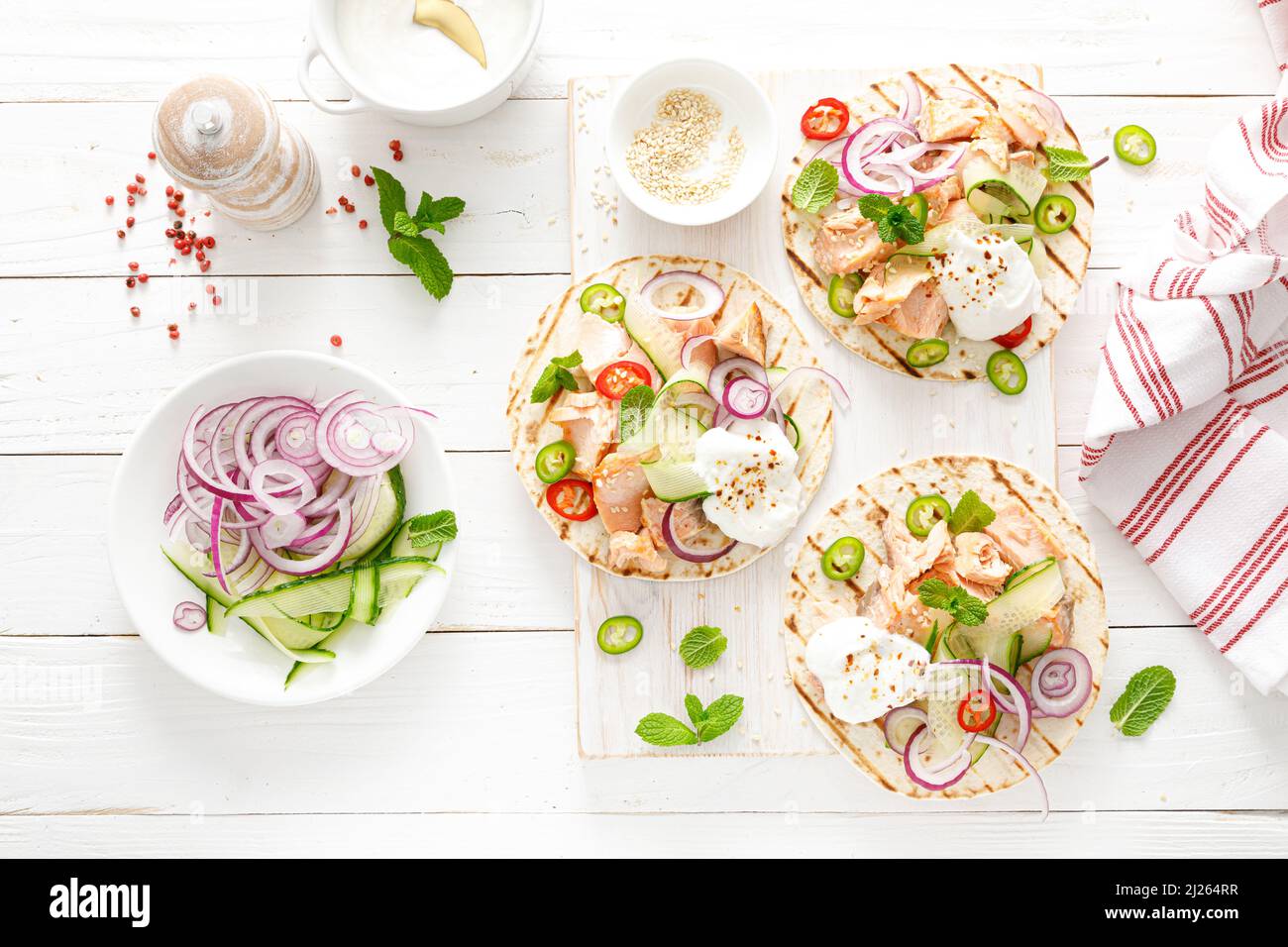 Spicy tacos with grilled salmon, vegetables, ricotta cheese, chili and ...