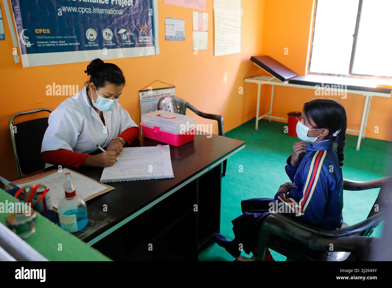 Infirmary in a primary school. Nurse giving medical consultation Stock ...