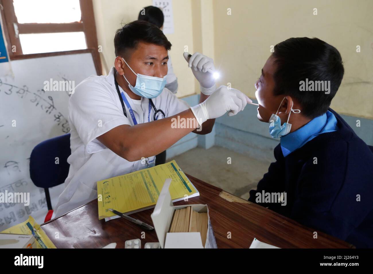 Infirmary in a primary school. Doctor giving medical consultation Stock ...