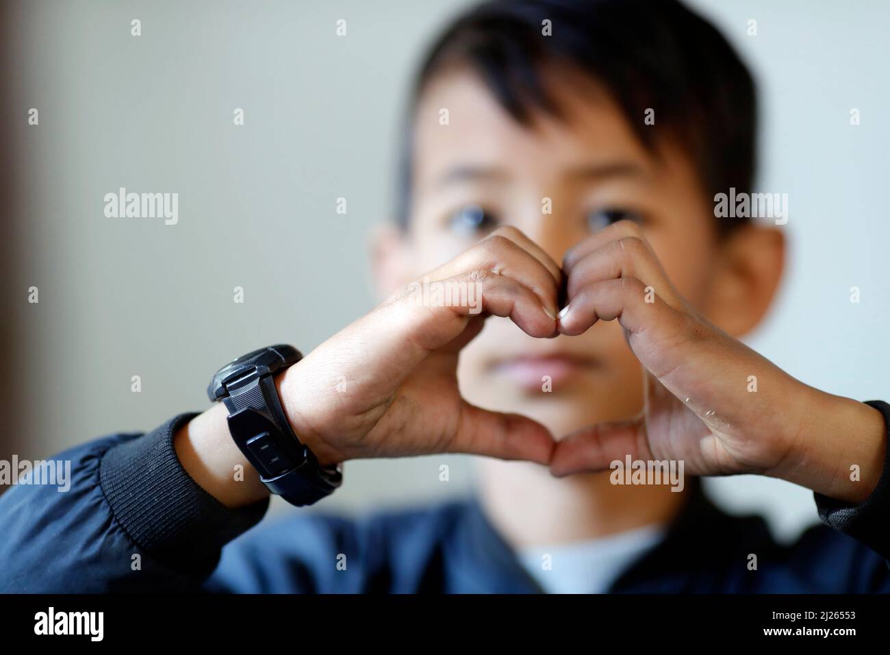 Child hand making heart hi-res stock photography and images - Alamy