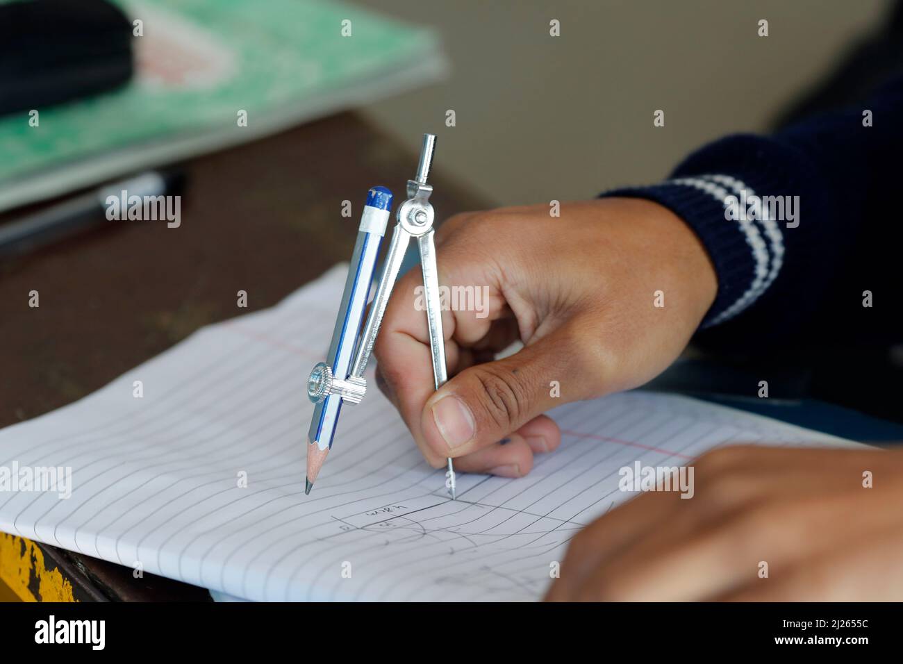 Primary school. Classroom. Pupil writing on notebook. Close-up Stock ...