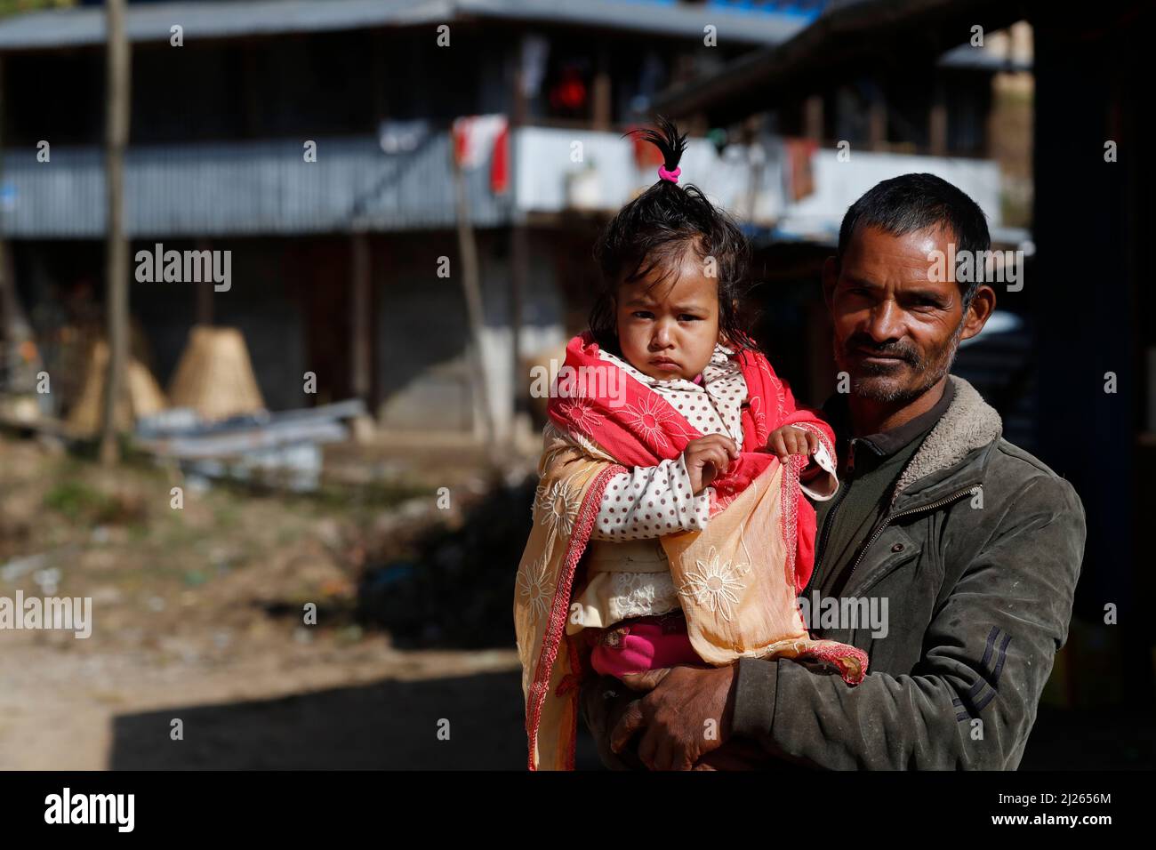 Nepalese father with his daughter in arms Stock Photo - Alamy