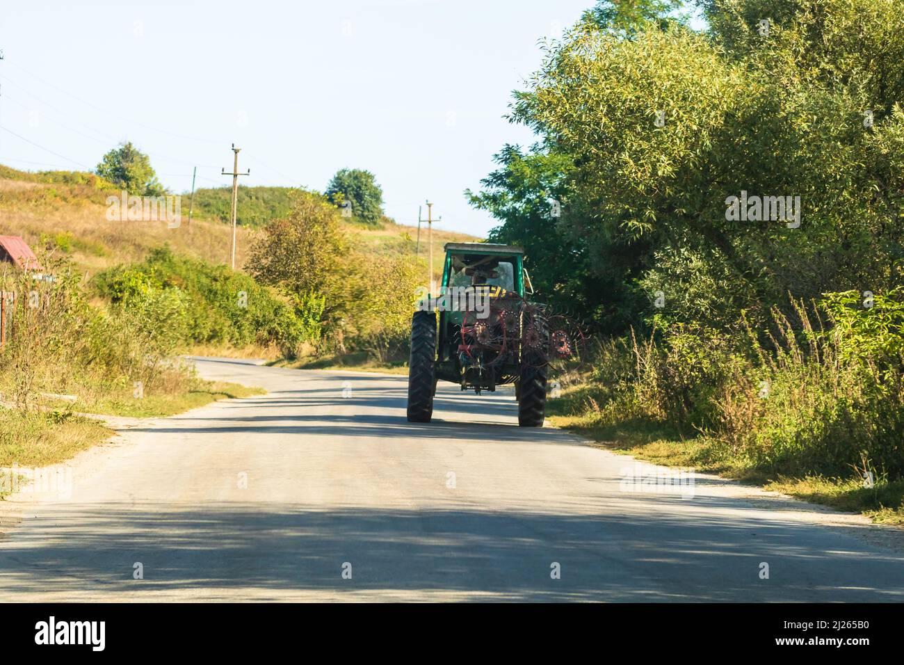 Agricultural tractor on road in Viscri, Romania, 2021 Stock Photo - Alamy