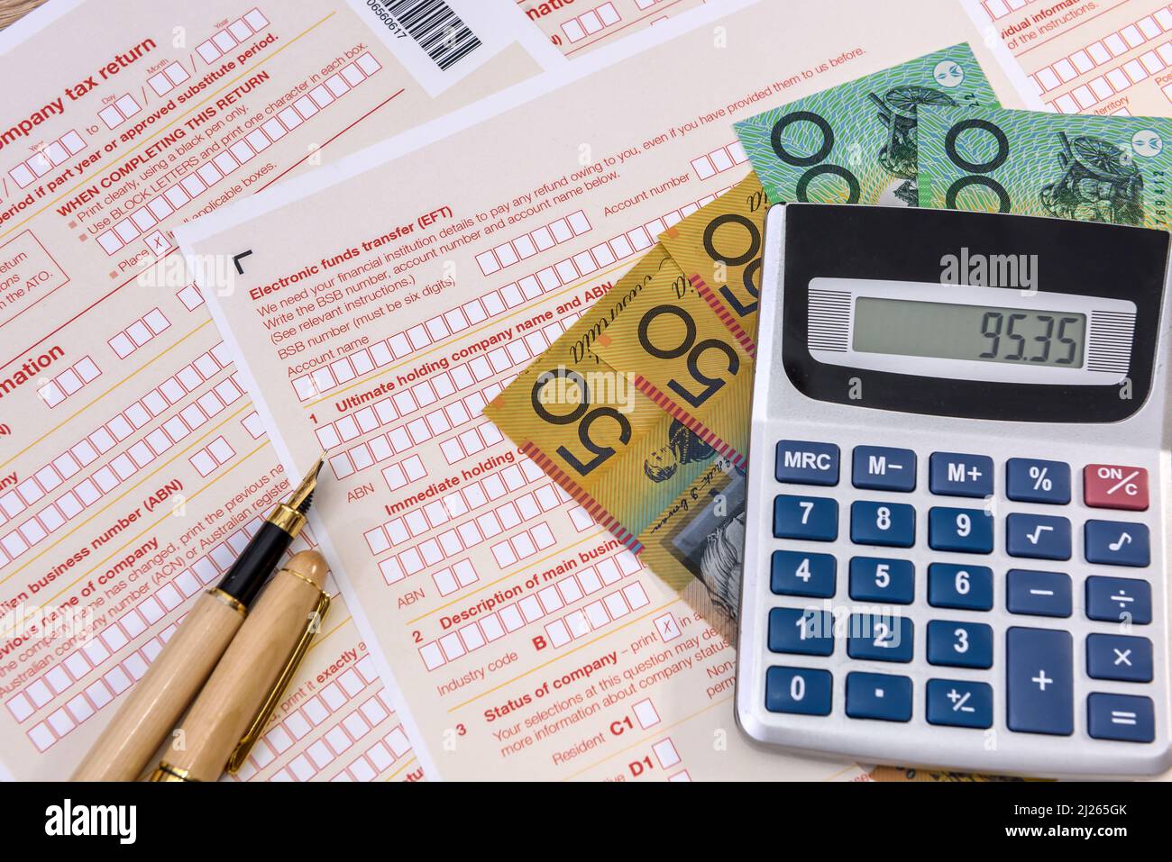 Australian tax form with pen, calculator and australian dollars Stock ...