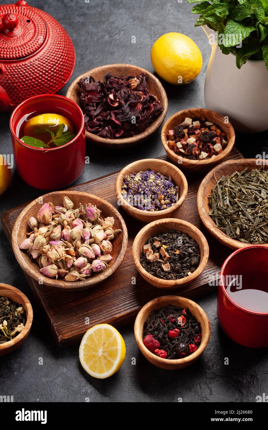 Various dried tea and teapot. Top view Stock Photo - Alamy