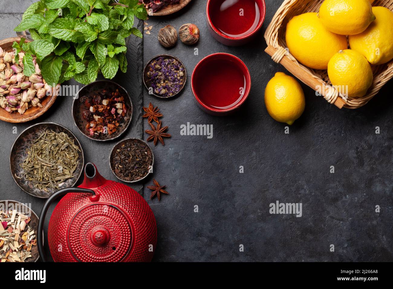 Various dried tea and teapot. Top view flat lay with copy space Stock ...