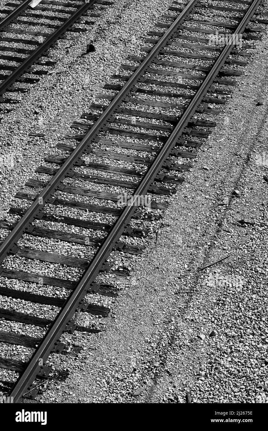 Railroad tracks at the local public train station Stock Photo - Alamy