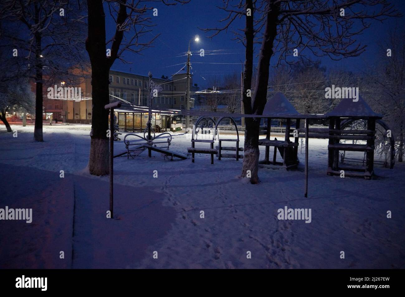 Snowy winter city in the night Stock Photo - Alamy