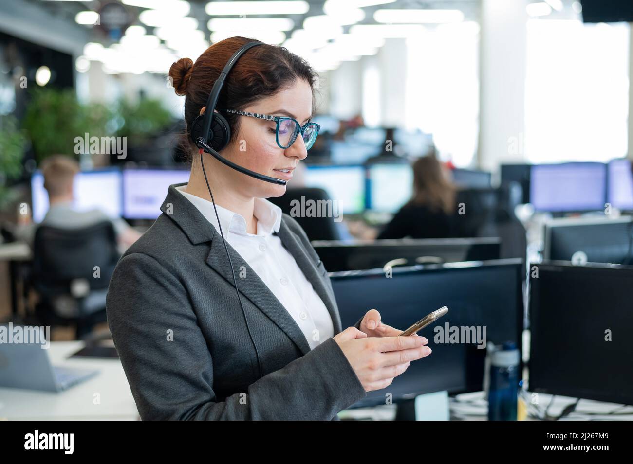 Standing call center agent headset hi-res stock photography and images ...