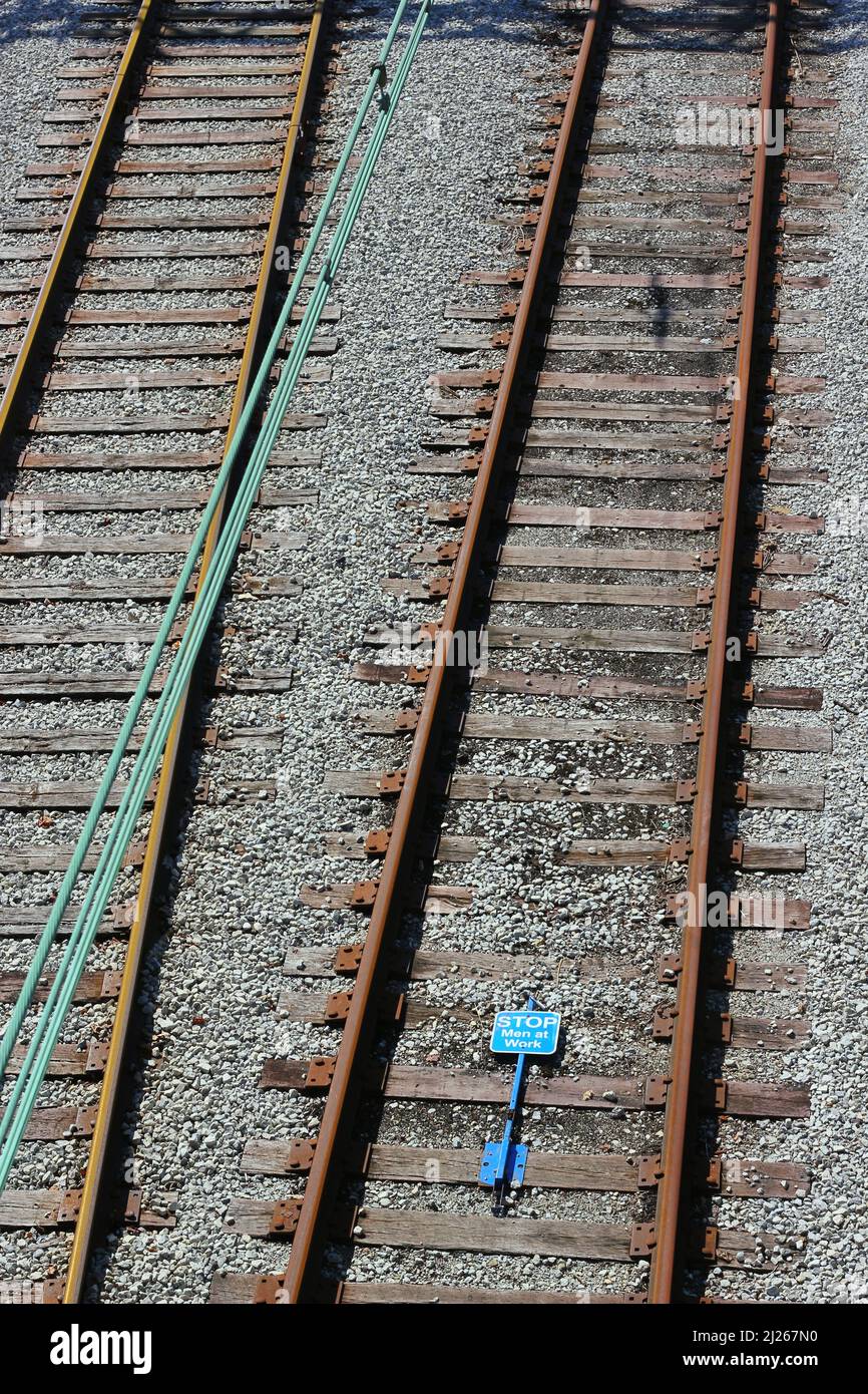 Railroad tracks at the local public train station Stock Photo - Alamy