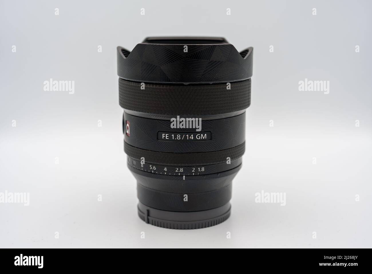 A closeup shot of full frame lens of Sony camera isolated on the white ...