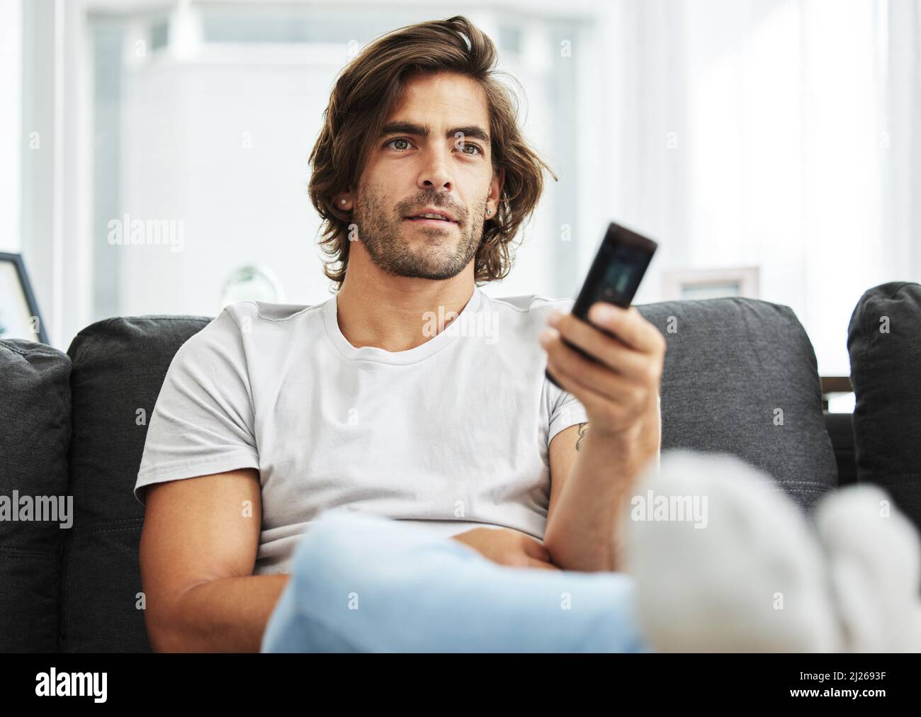 Man watch tv alone hi-res stock photography and images - Alamy