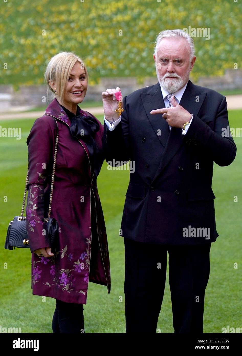 Queen drummer Roger Taylor with his wife Sarina, after being made an ...