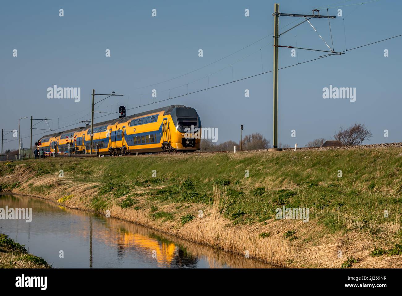 Amsterdam, Netherlands, march 2022. Dutch train in the landscape and in ...