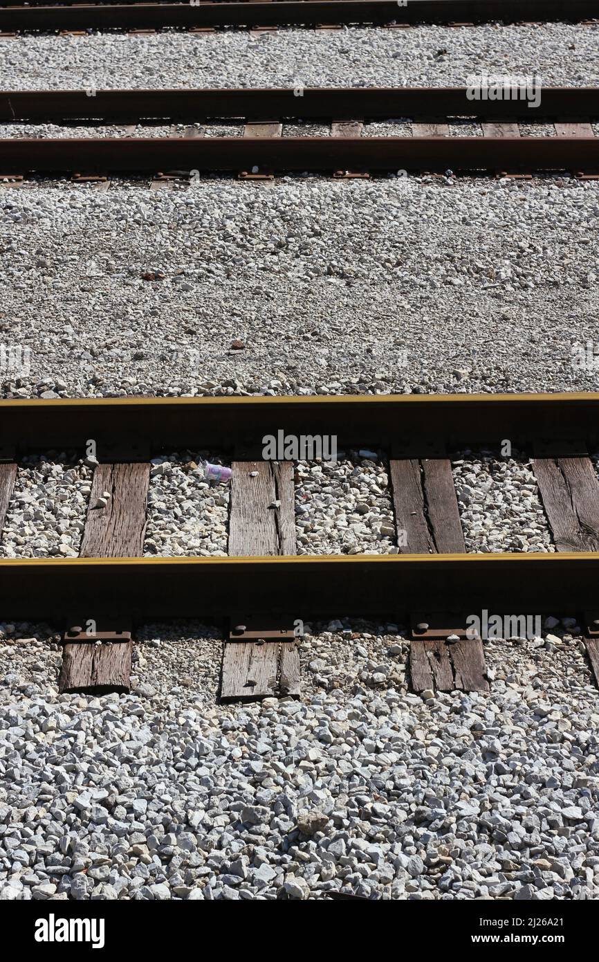 Railroad tracks at the local public train station Stock Photo - Alamy